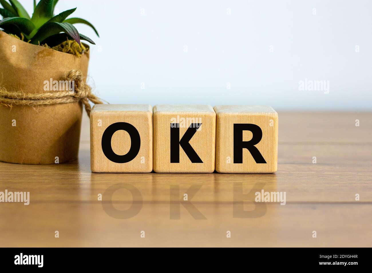 OKR symbol. Concept words 'OKR - objectives and key results' on cubes ...