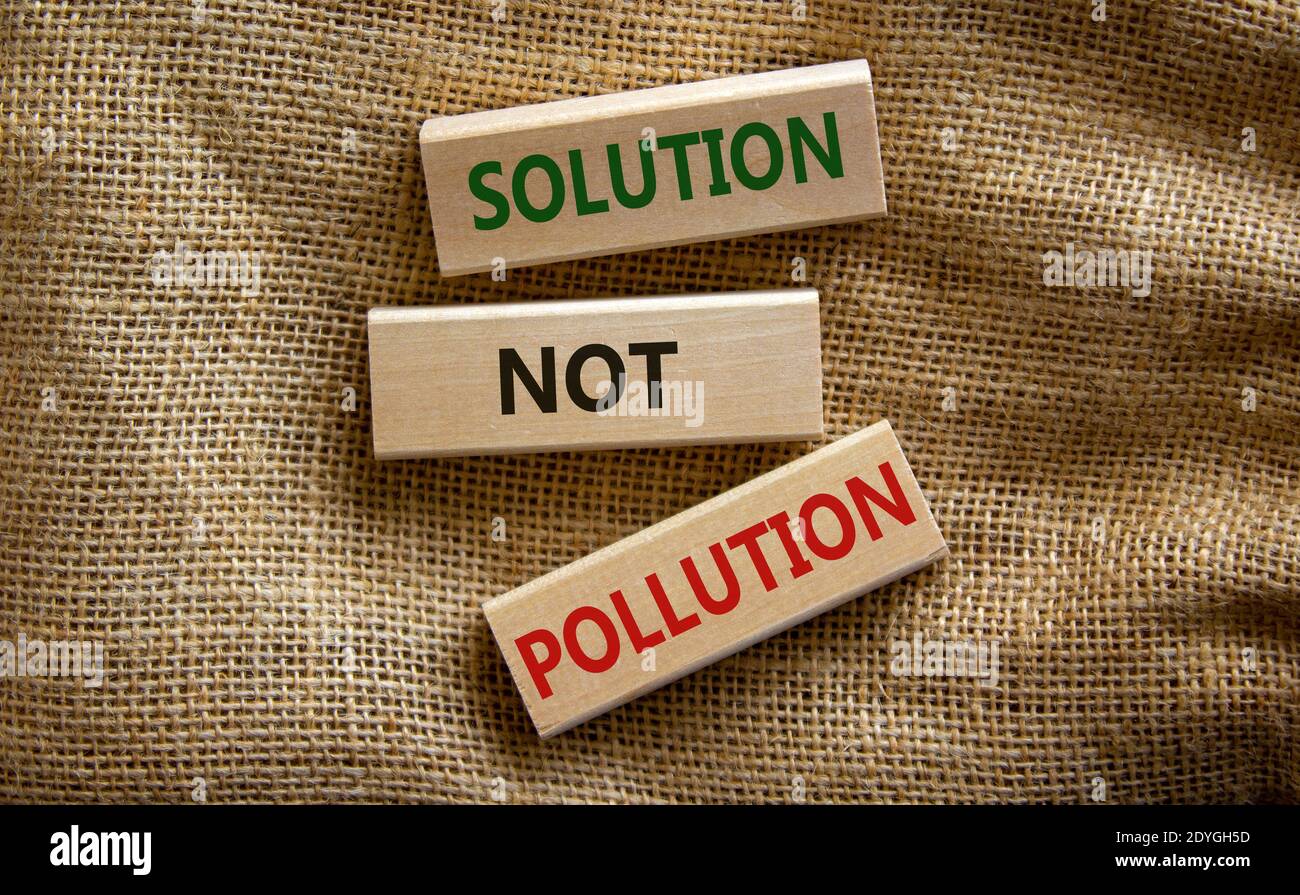 Solution not pollution symbol. Wooden blocks with words 'Solution not ...