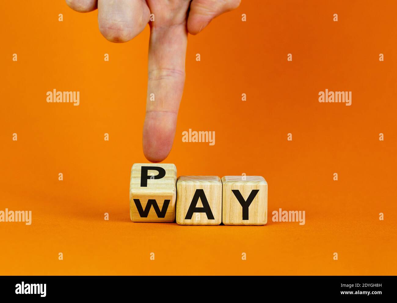 Way to pay symbol. Businessman hand turns a cube and changes the word ...