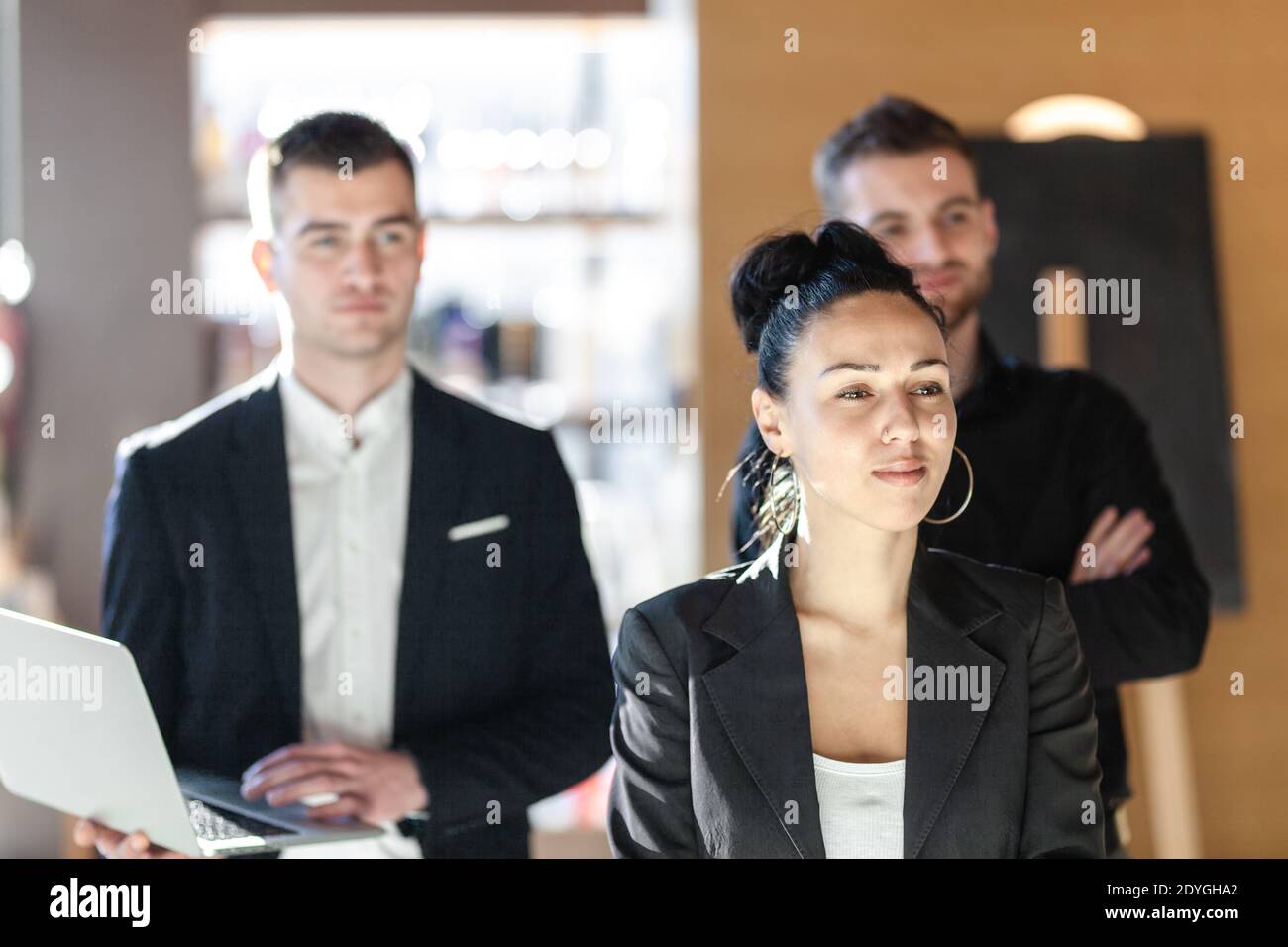 Team of three business people looking forward Stock Photo - Alamy
