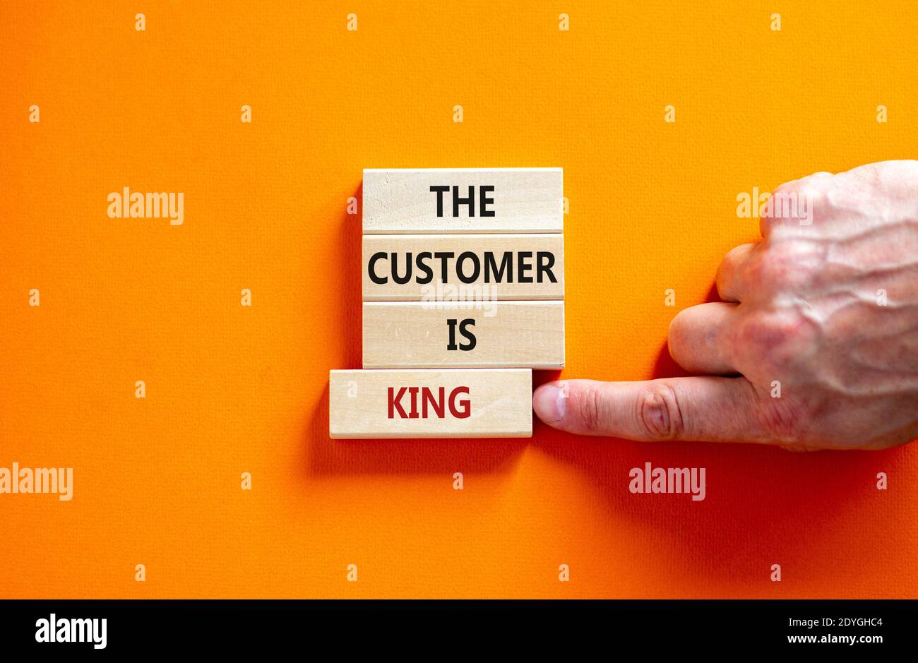 Customer is king symbol. Wooden blocks with words 'The customer is king ...