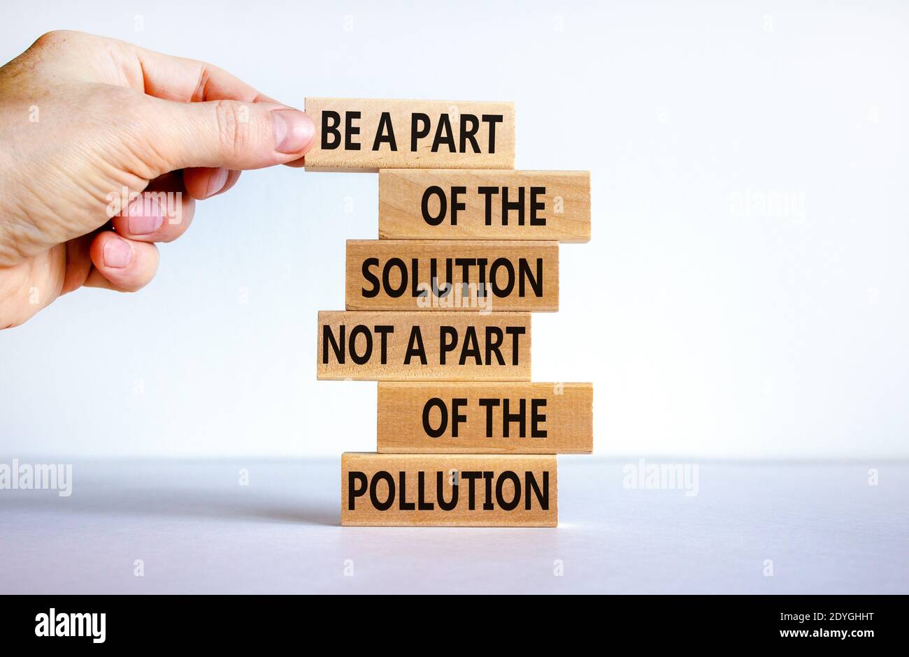 Solution not pollution symbol. Wooden blocks with words 'Be a part of ...