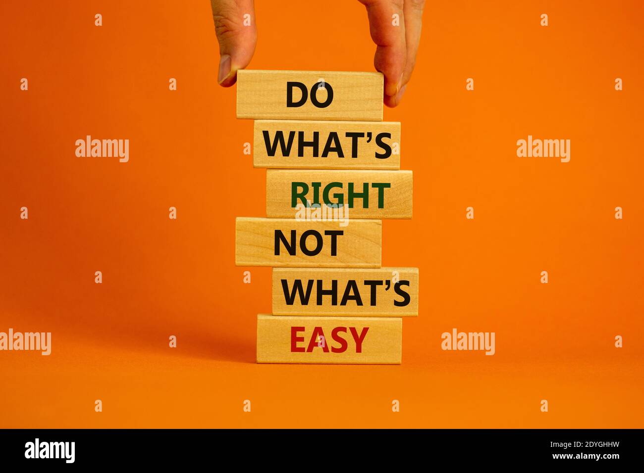 Motivation symbol. Wooden blocks with words 'do whats right not whats ...