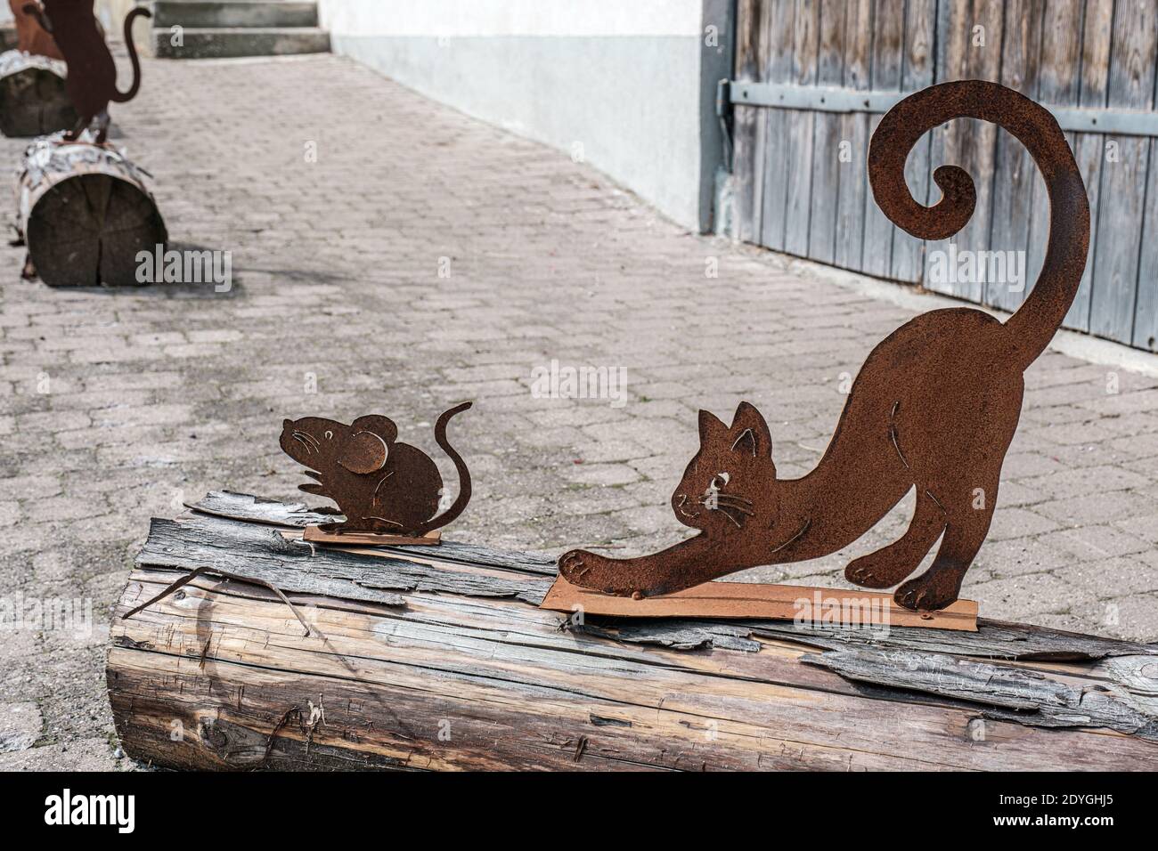 Iron metal figure statue of cat in old swiss town Stock Photo - Alamy