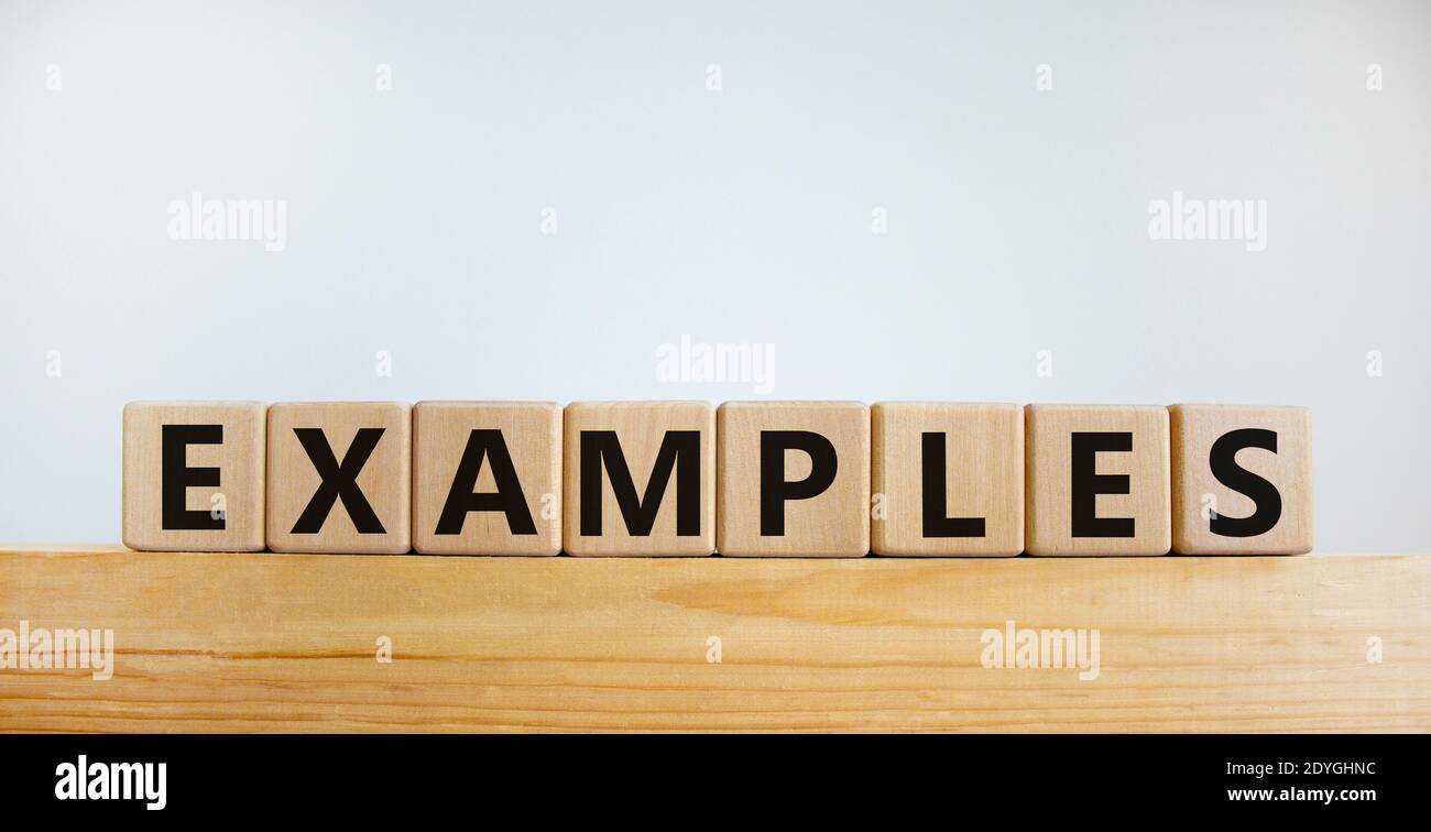 Examples symbol. Concept word 'examples' on wooden cubes on a beautiful ...