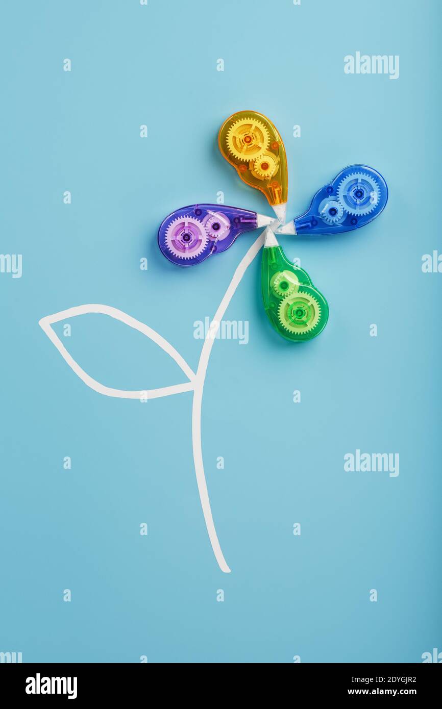 Colorful Stationery correction tapes in the shape of a flower on a blue ...