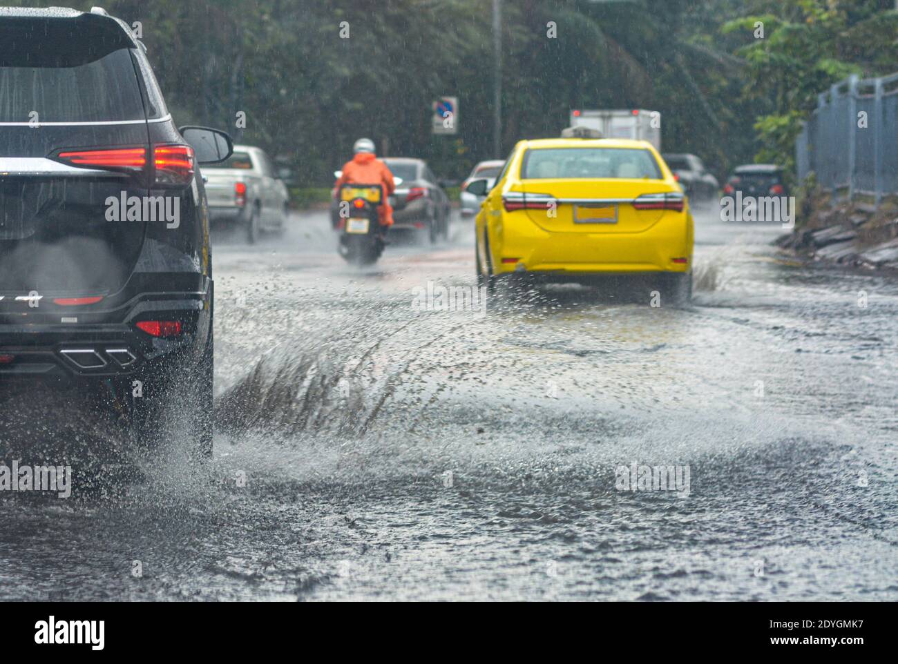 Car driving through flood Stock Photo - Alamy