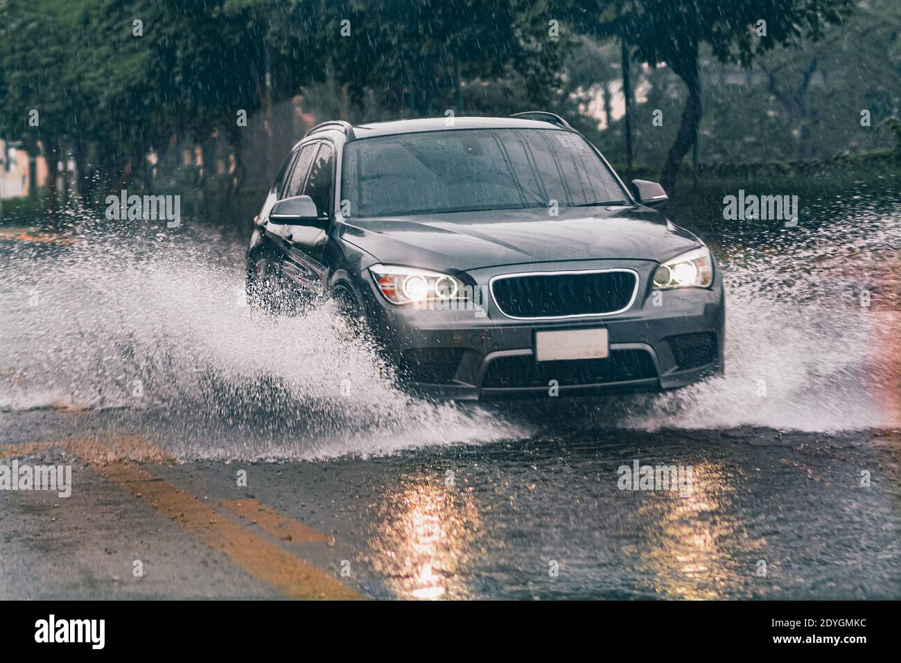 Car driving through flood Stock Photo - Alamy