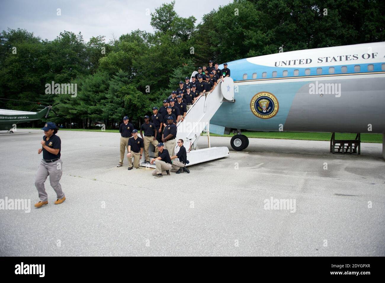 Law enforcement explorers aboard stairs to plane 3 Stock Photo - Alamy