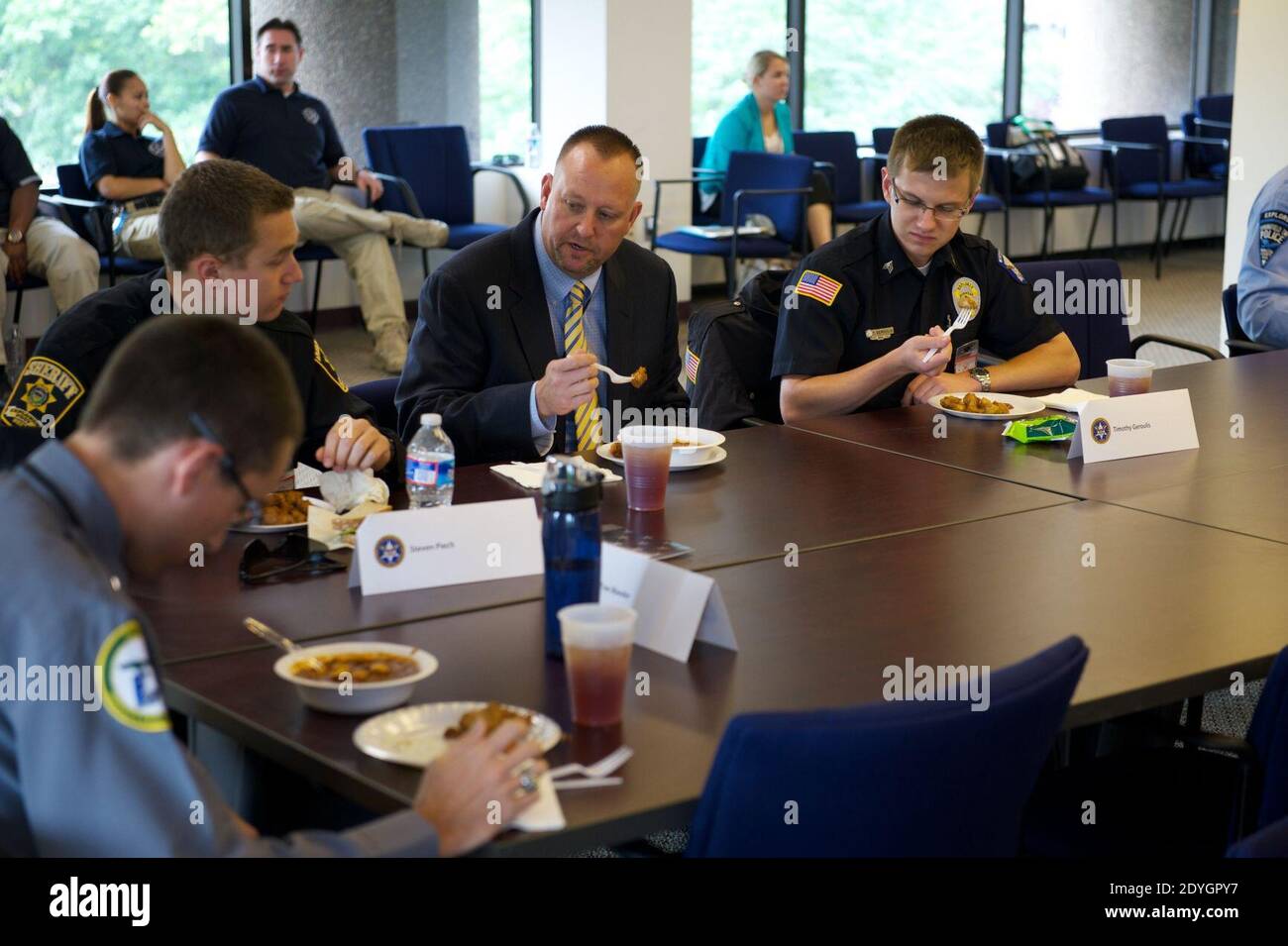 Seated around the table hi-res stock photography and images - Alamy