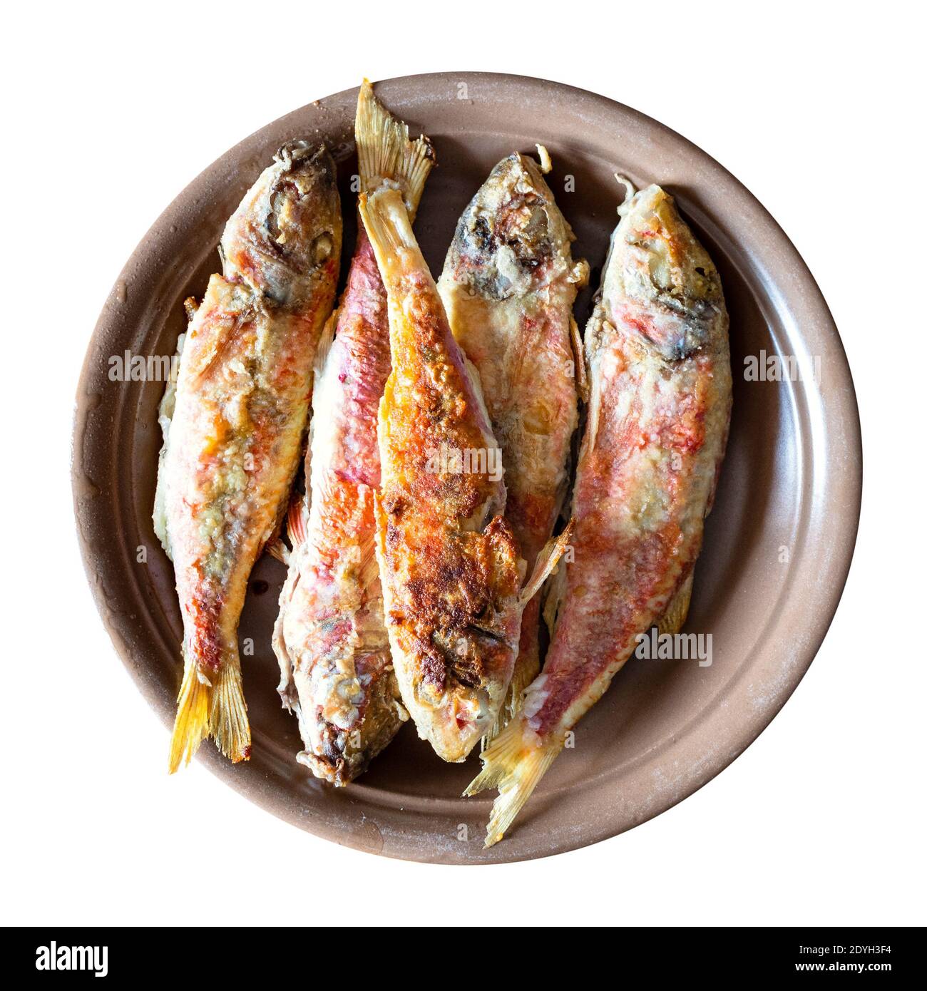 top view of fried red mullet fishes on brown ceramic plate cut out on ...