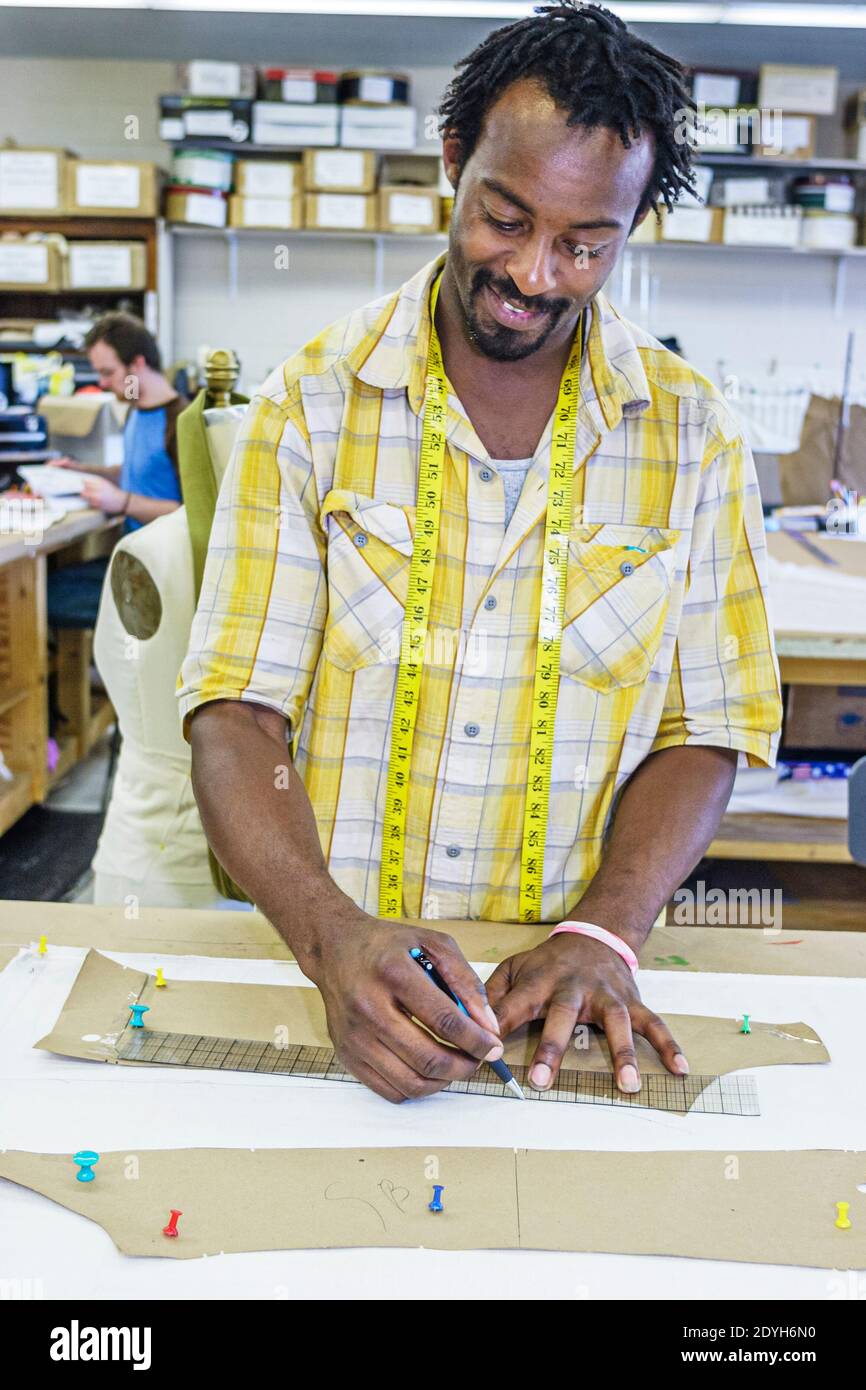 Black man male tailor pattern working hi-res stock photography and ...