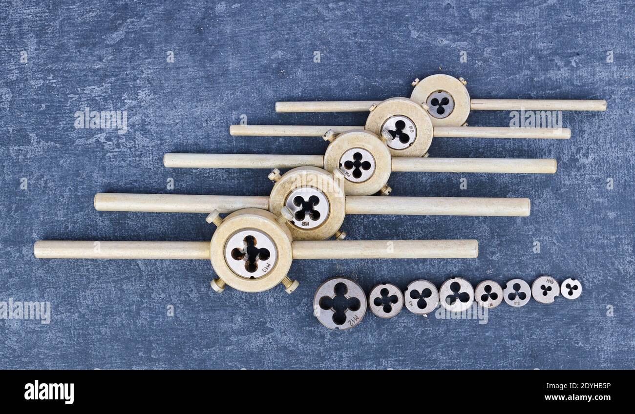 Old used kit for cutting an external thread, close up, top view ...