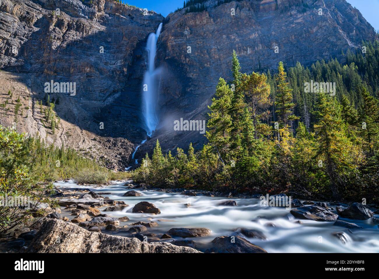 Takakkaw Falls Waterfall and Yoho River in a sunny summer day. Natural ...