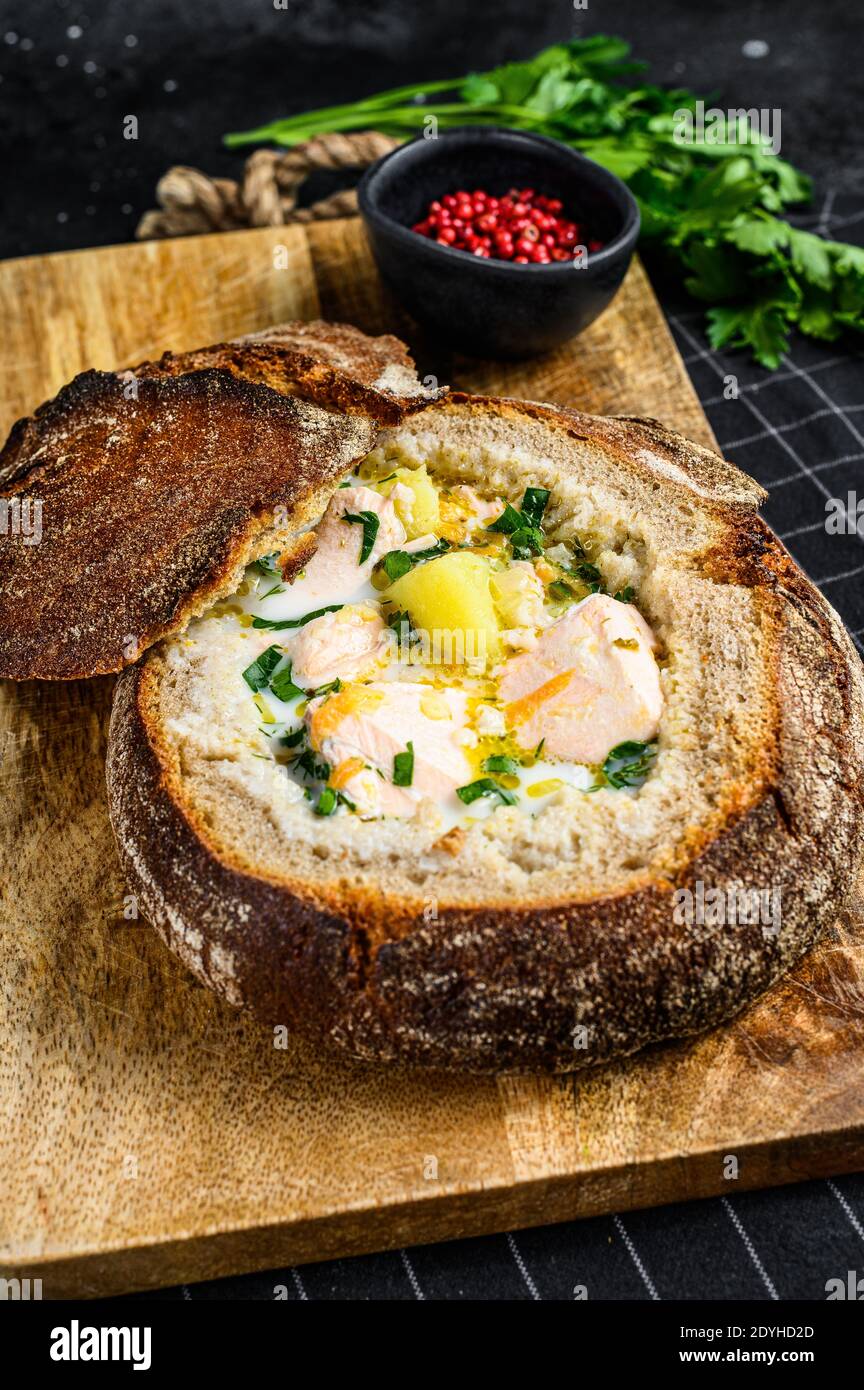 Salmon soup served in bread. Creamy hearty fish soup. healthy and diet ...