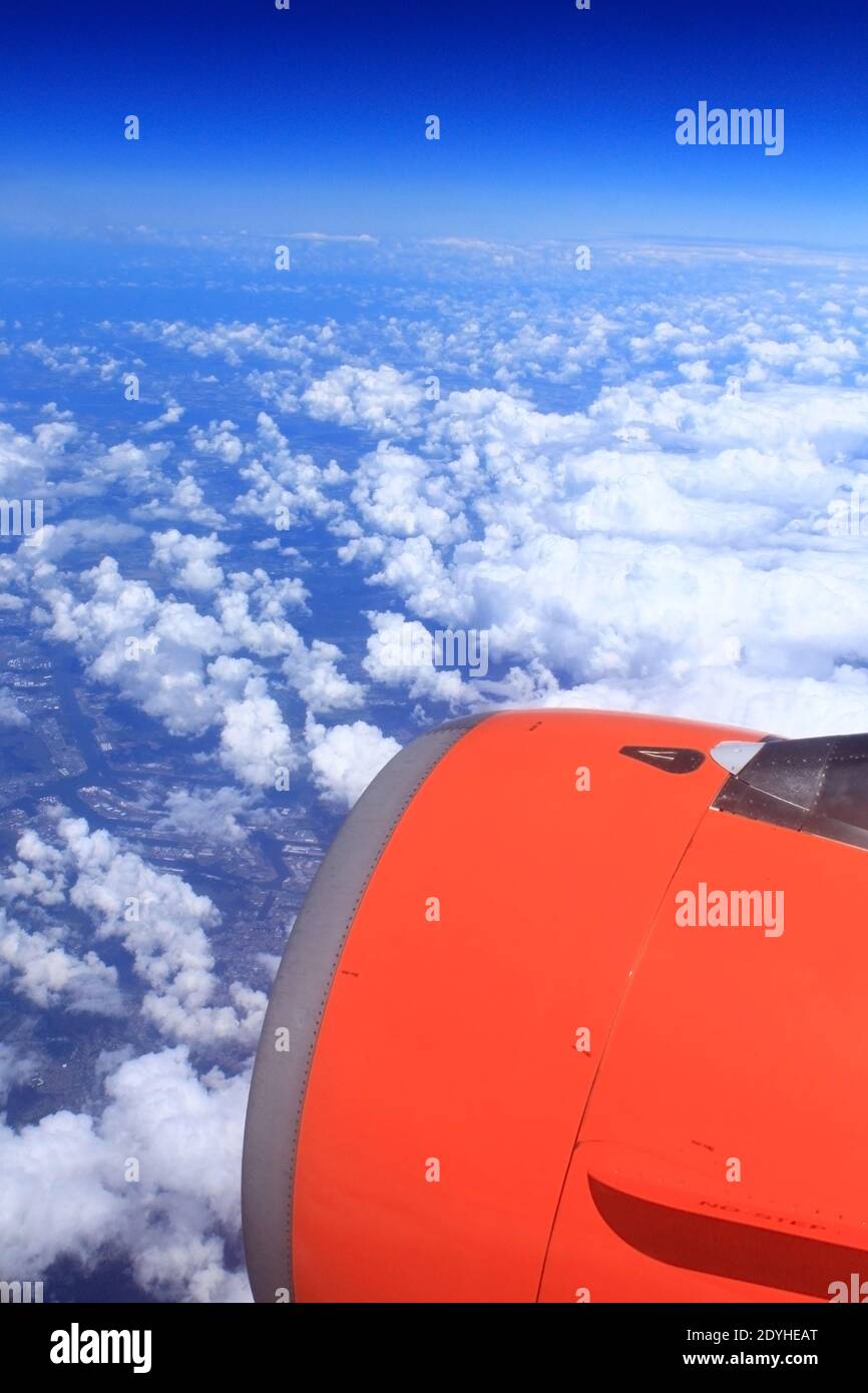 Flying airplane over the clouds and another plane flying in the ...