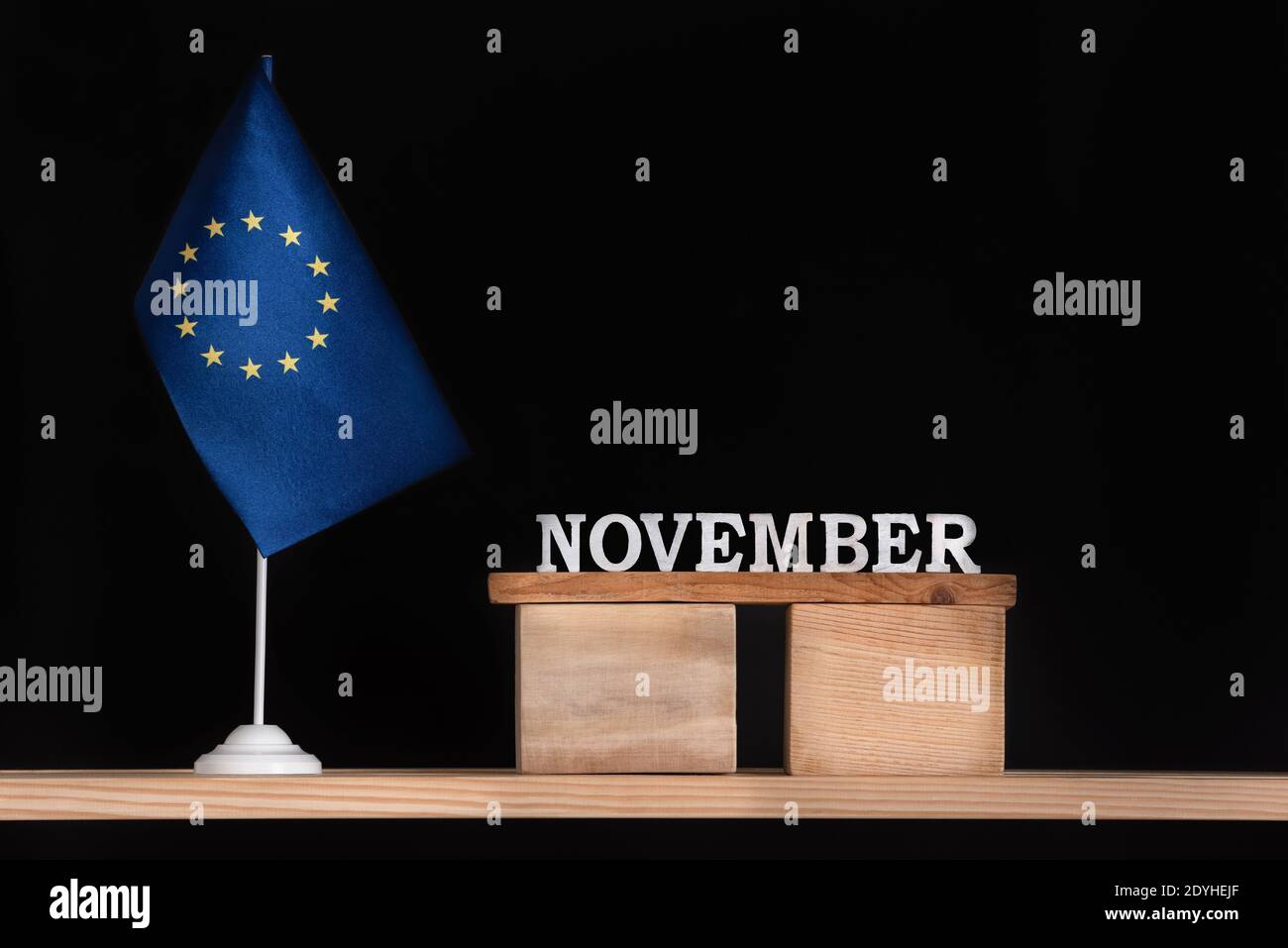 Wooden calendar of November with flag EU on black background. European ...