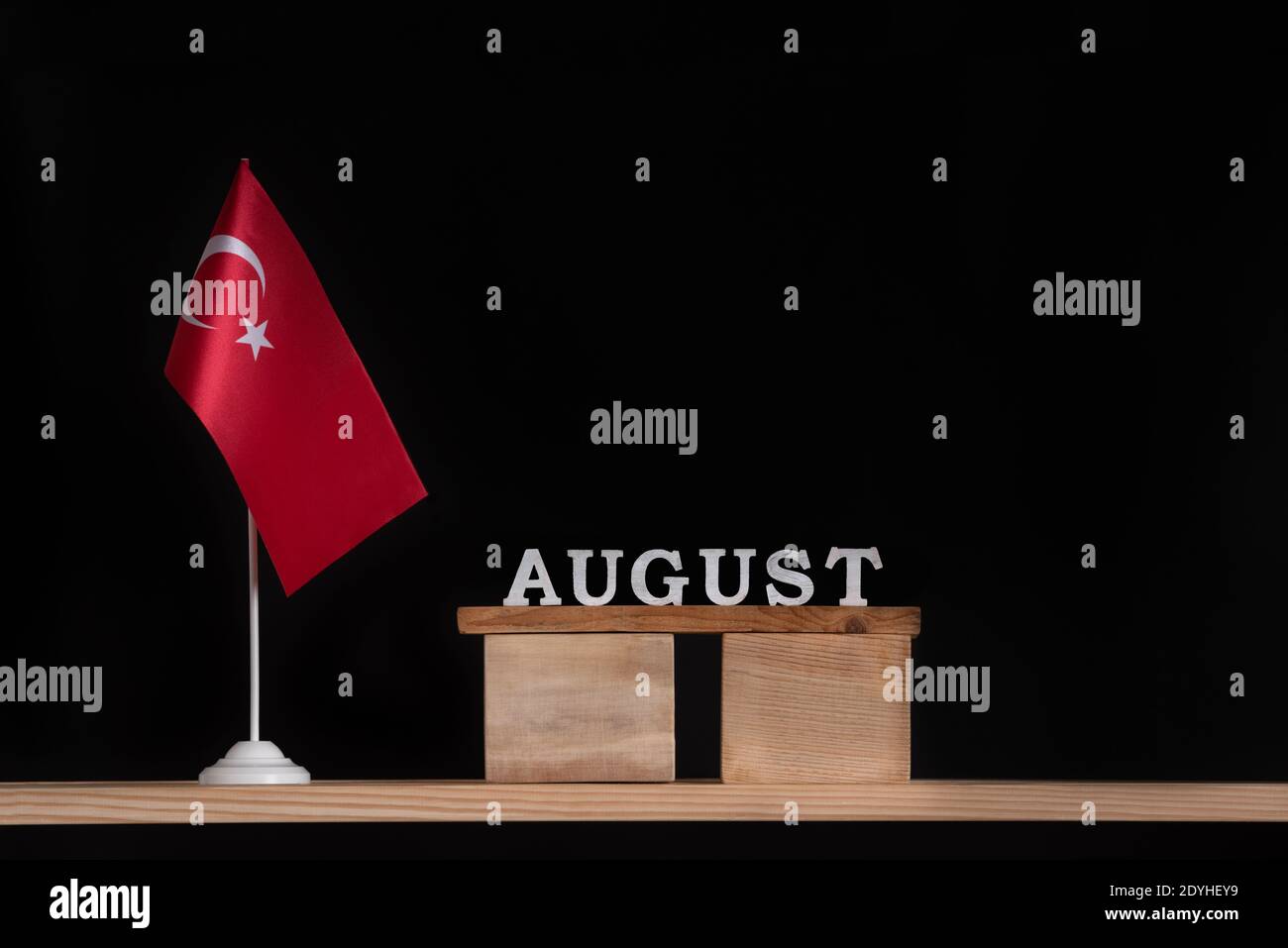 Wooden calendar of August with Turkish flag on black background ...