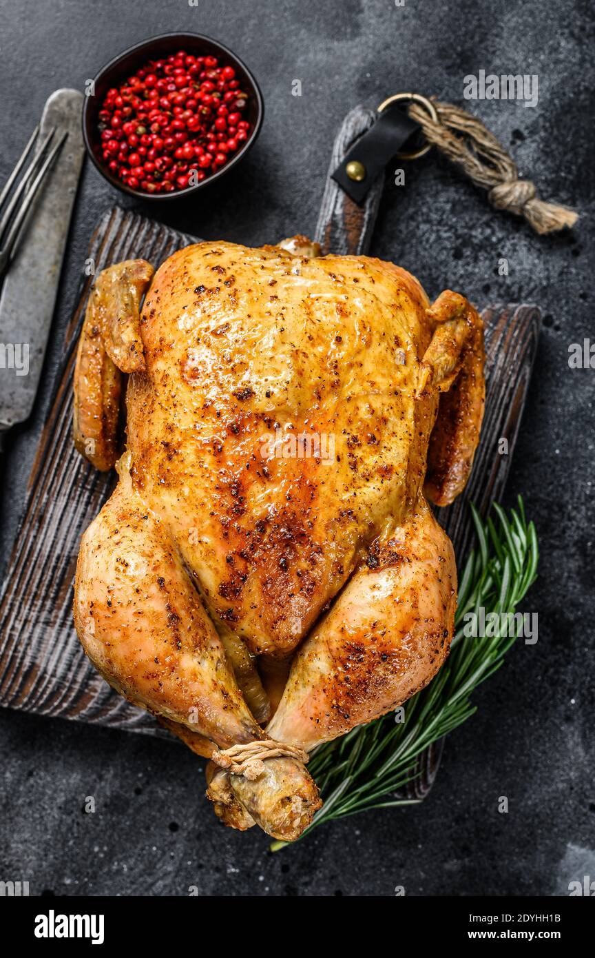 Grilled roasted whole Chicken. Black background. Top view Stock Photo ...