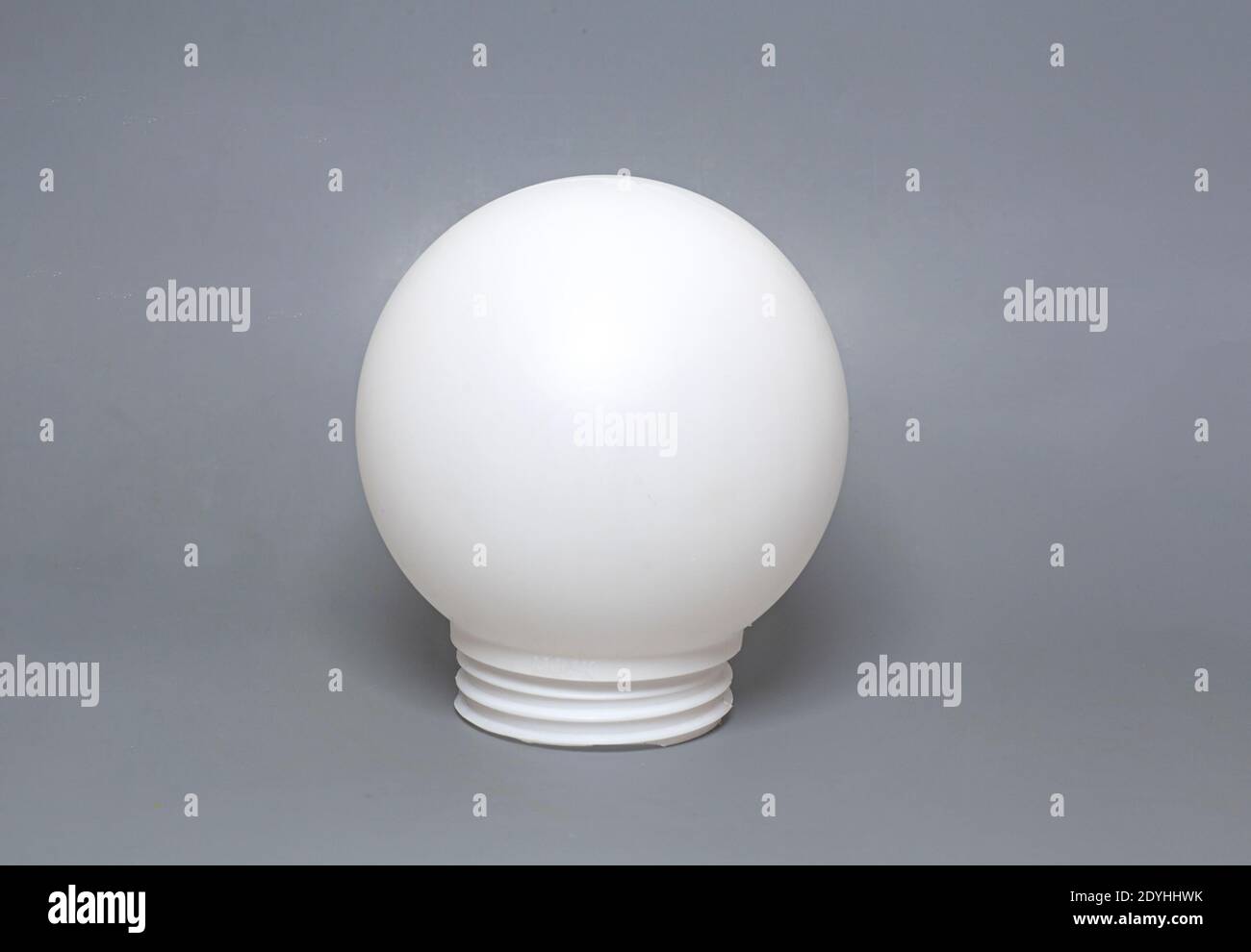 Round white lampshade on grey background Stock Photo - Alamy