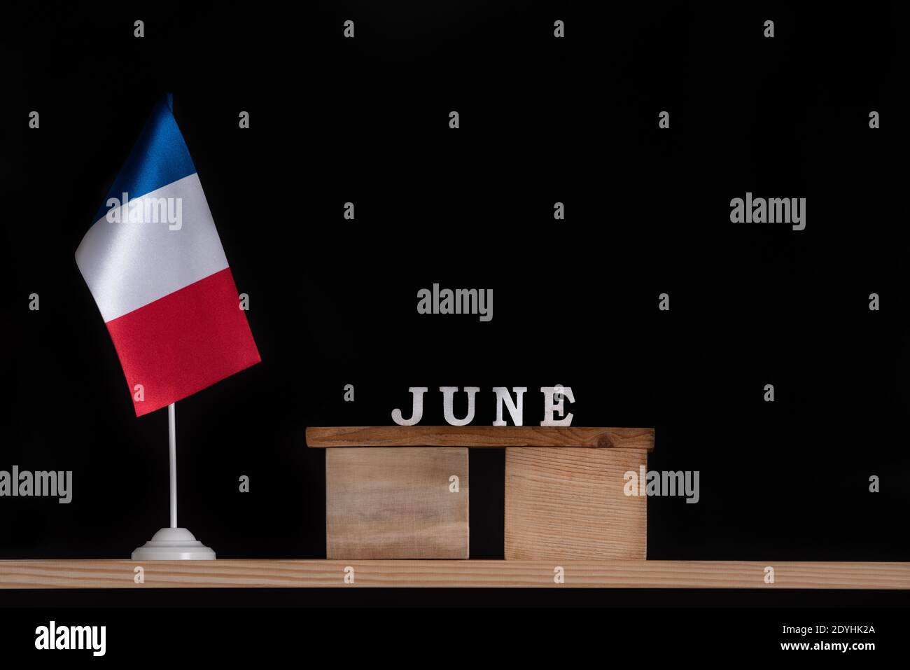 Wooden calendar of June with French flag on black background. Holidays ...