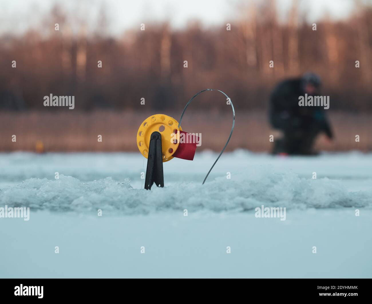 winter fishing with fisher Stock Photo - Alamy