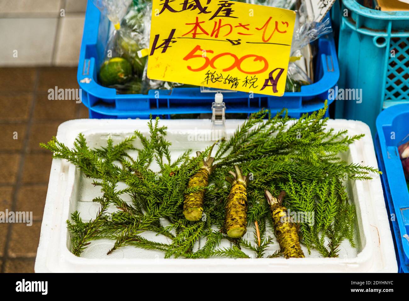 Fresh wasabi stalks at a market in Tokyo. The outer layer of the stem ...