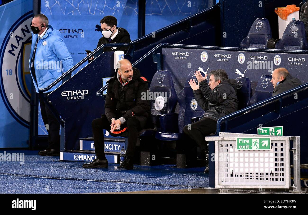 Manchester City manager Pep Guardiola (left) on the bench during the ...