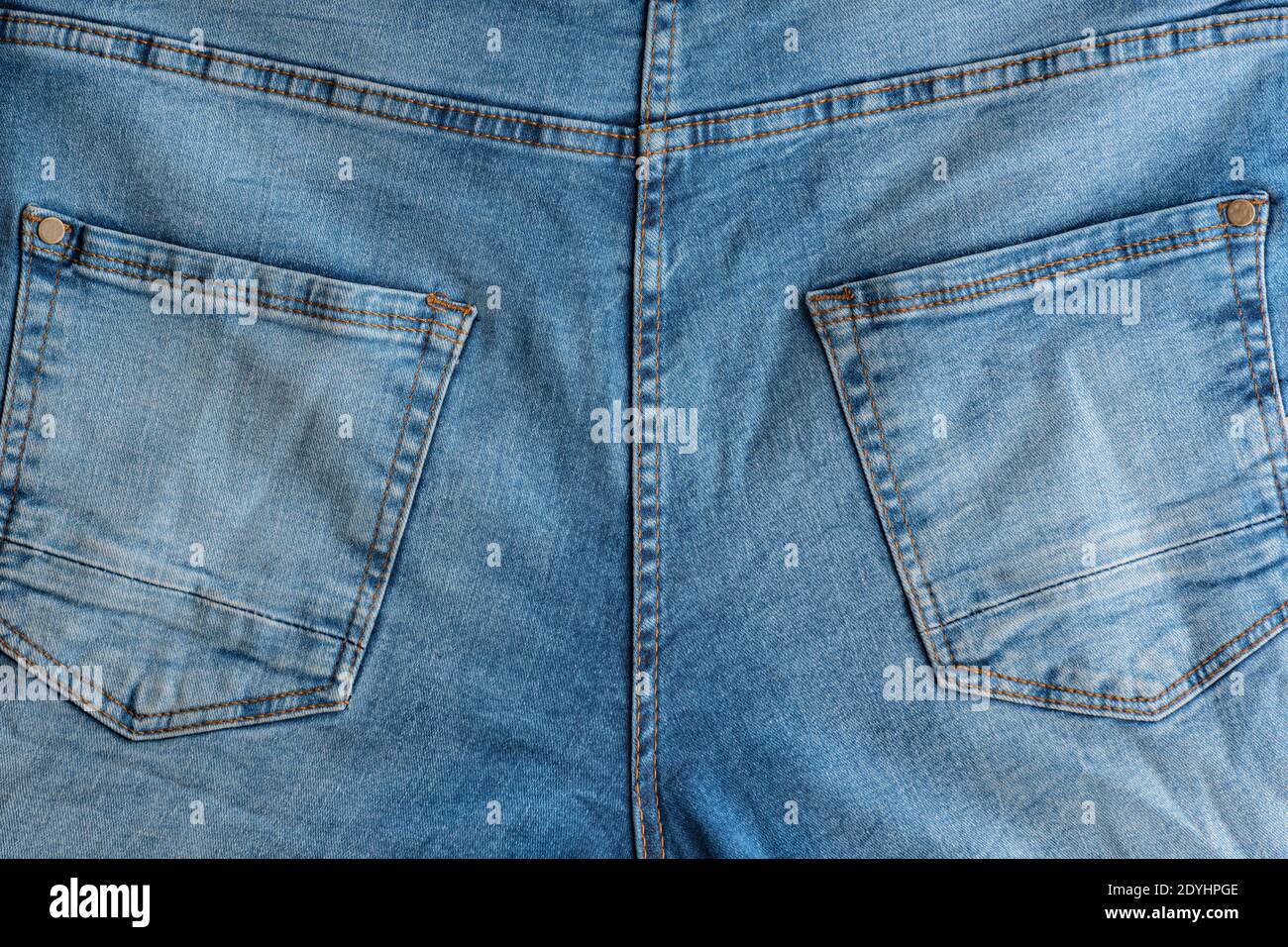 Back of classic jeans. Denim fabric. Yoke, back Pockets Stock Photo - Alamy