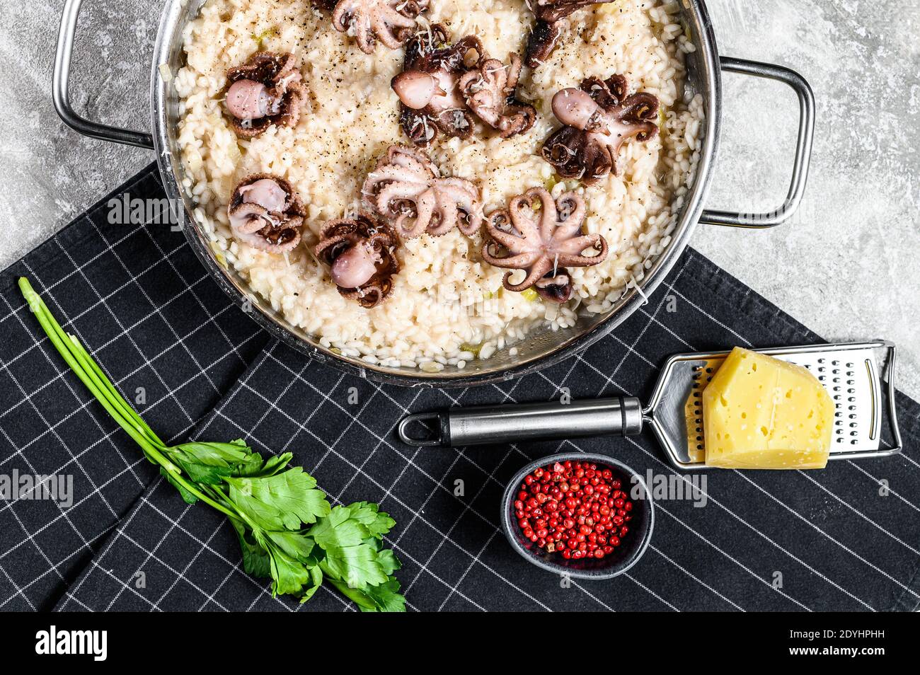 Italian Risotto with octopus and mushrooms decorated with Parmesan and ...