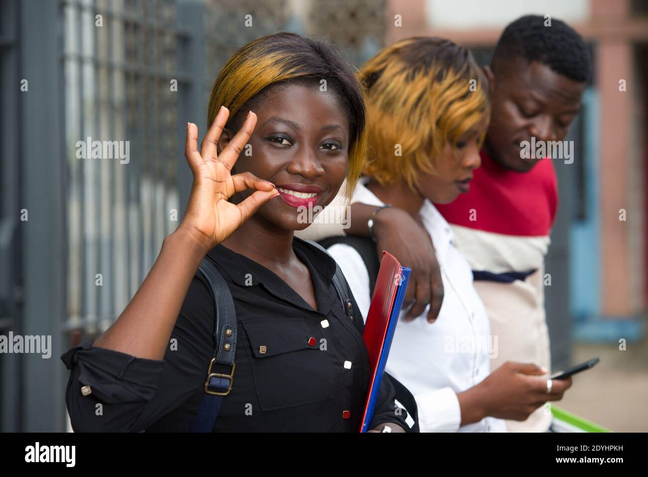 group of students standing outside university building.Group of friends ...