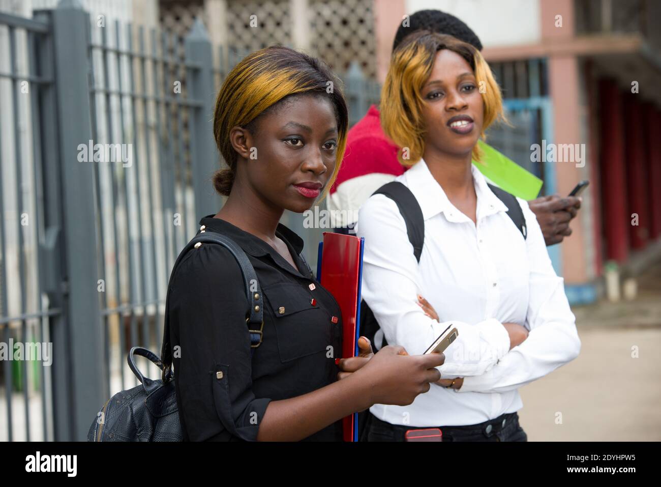 group of students standing outside the university building.Group of ...