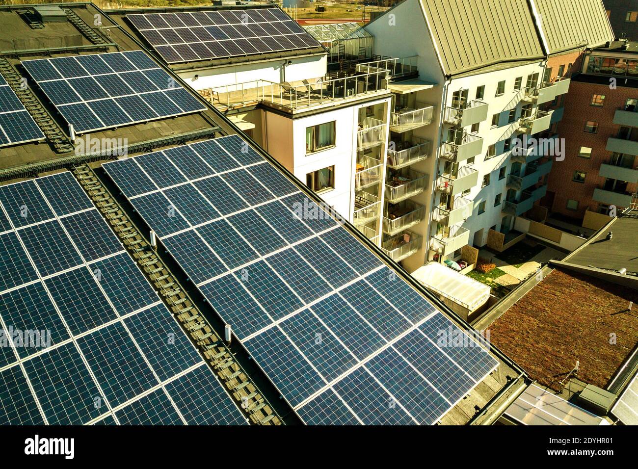 Aerial view of solar photovoltaic panels on a roof top of residential ...