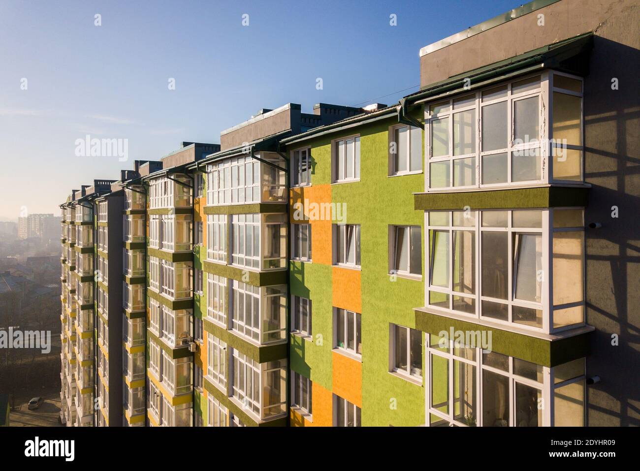 Aerial view of a tall residential apartment building with many windows ...