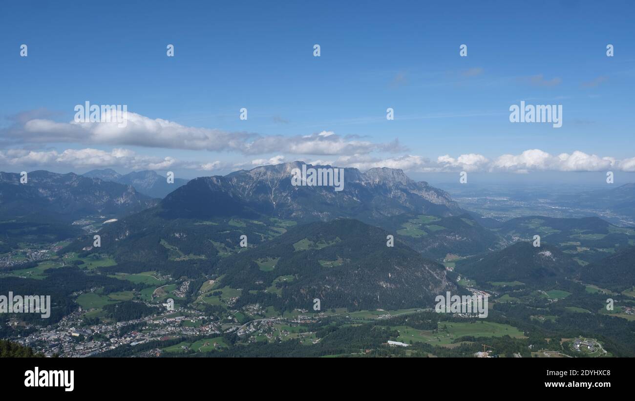 An aerial shot of the beautiful Bavarian Alps surrounded by clouds ...