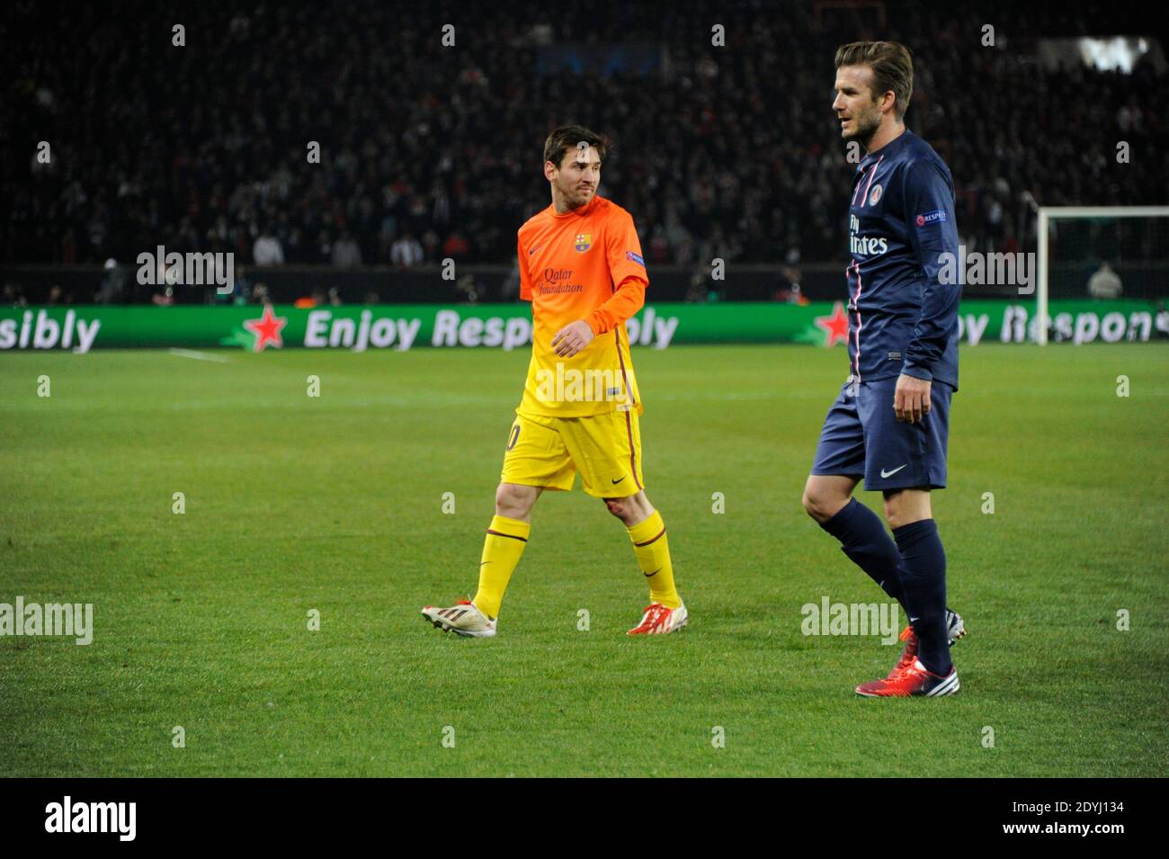 PSG's David Beckham battling Barcelona's Lionel Messi during the ...