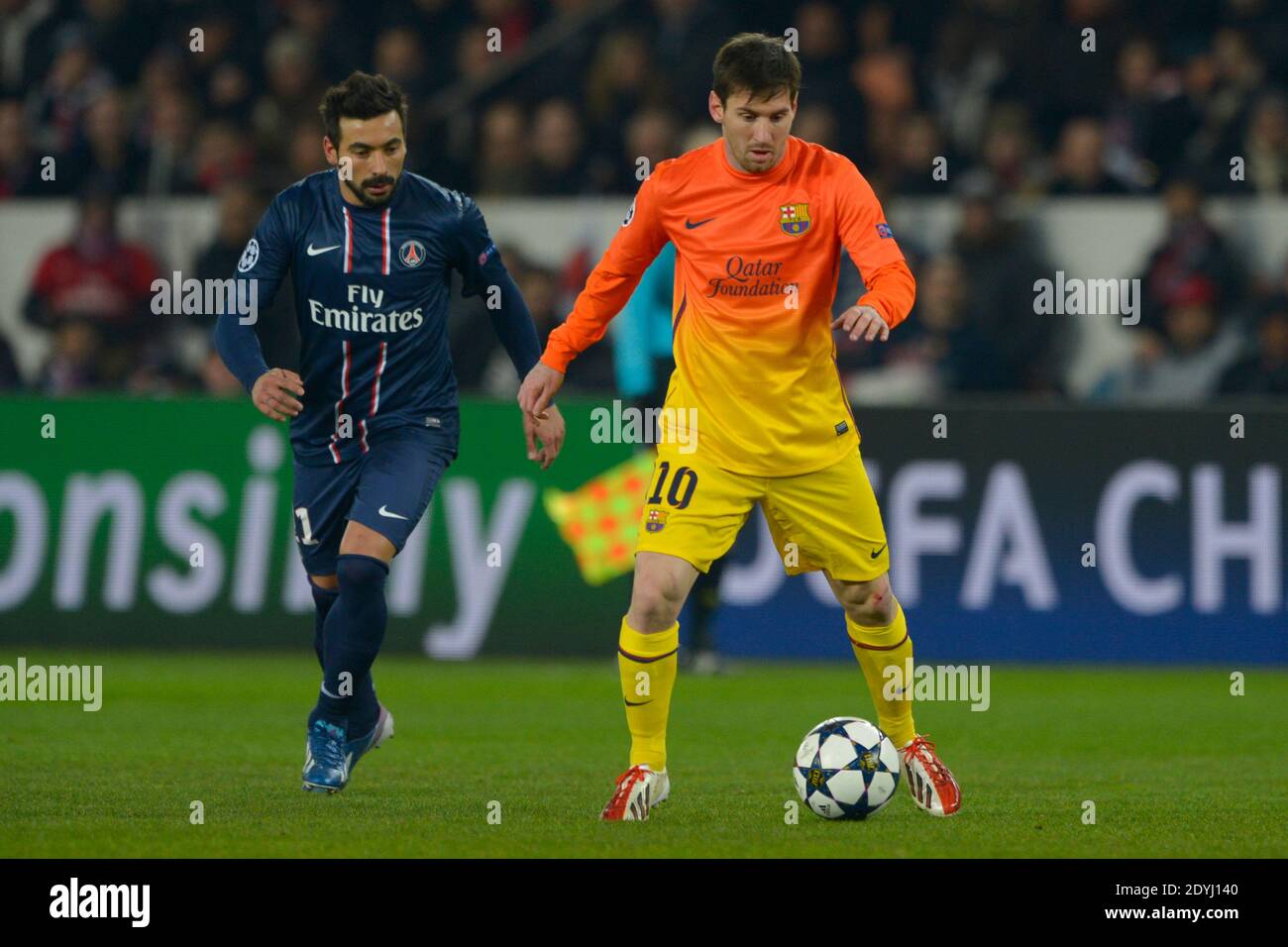 PSG's Ezequiel Lavezzi battling Barcelona's Lionel Messi during the ...