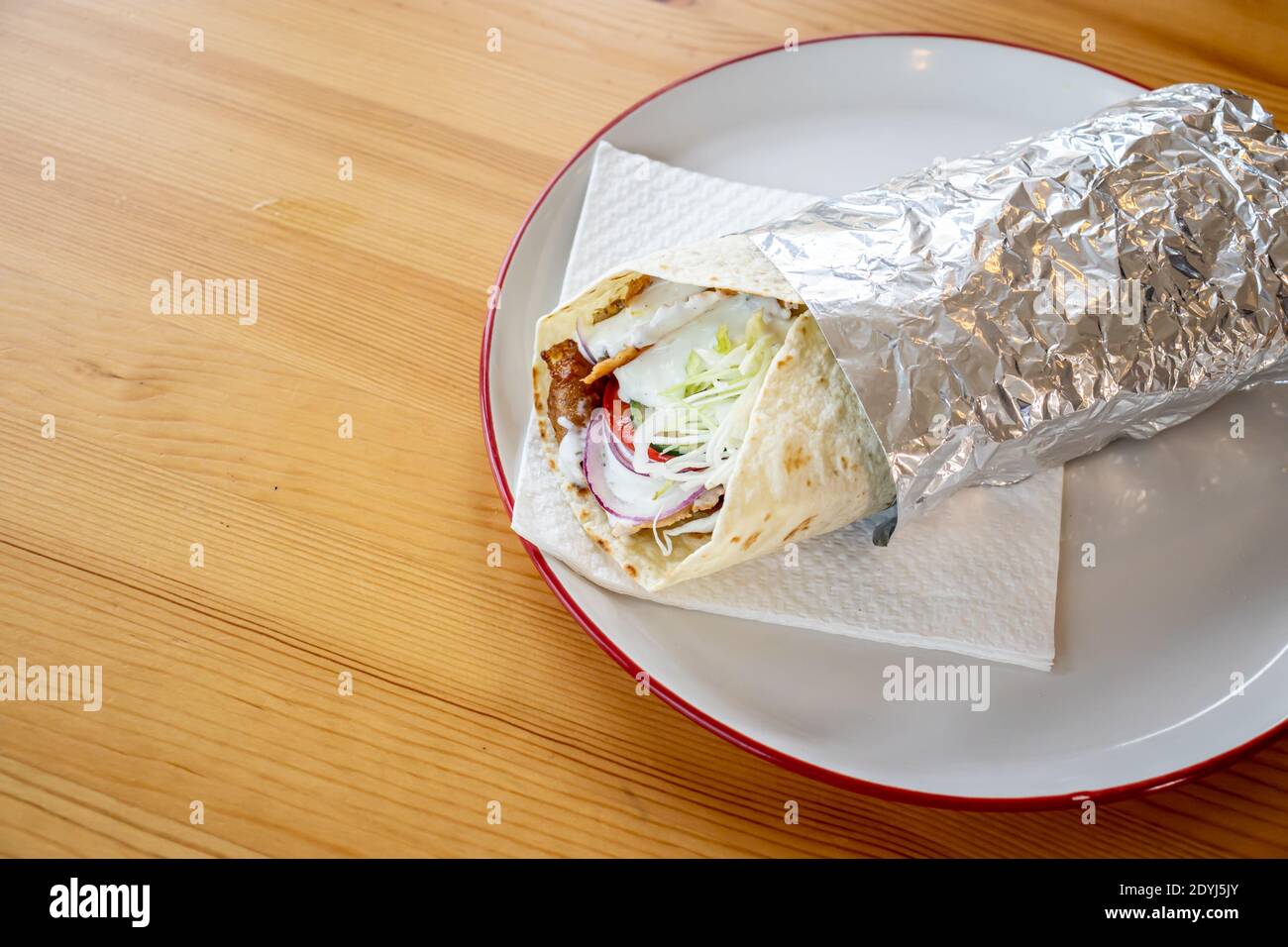 Durum Kebab in a local pizza and gyros restaurant Stock Photo - Alamy