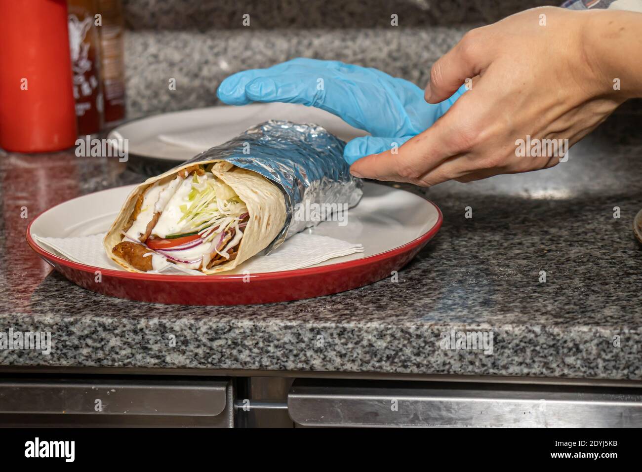 Durum Kebab is being prepared in a local pizza and gyros restaurant ...