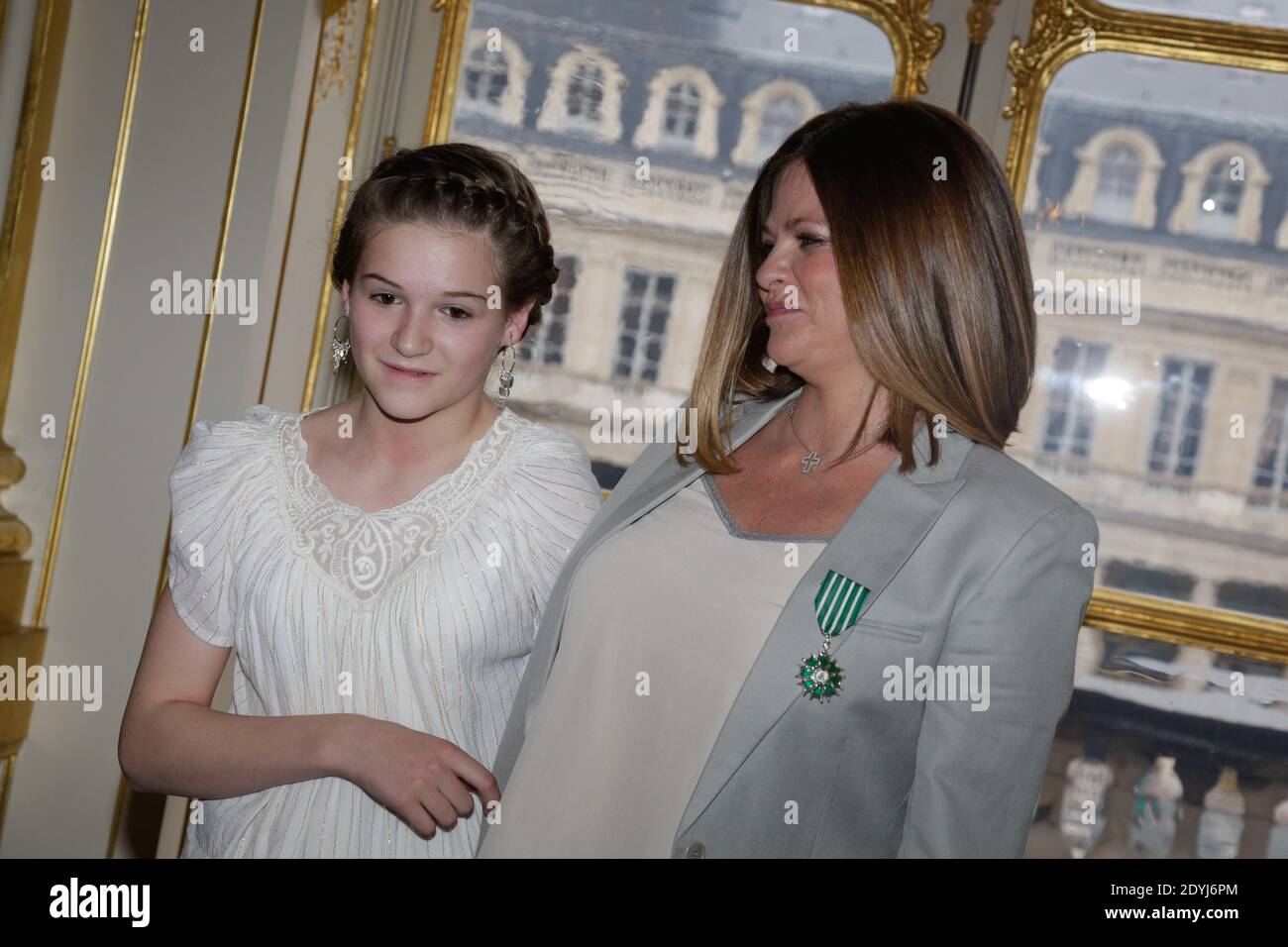 Charlotte Valandrey, flanked by her daughter, is presented with ...
