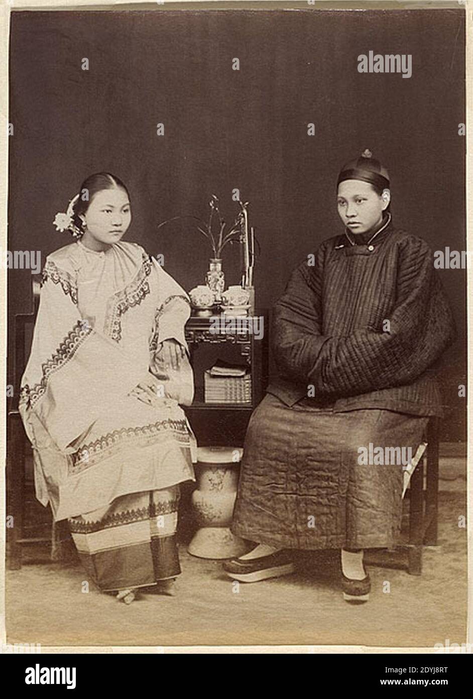 Lai Afong two Chinese women in studio one in scholar robes c1885 Stock ...