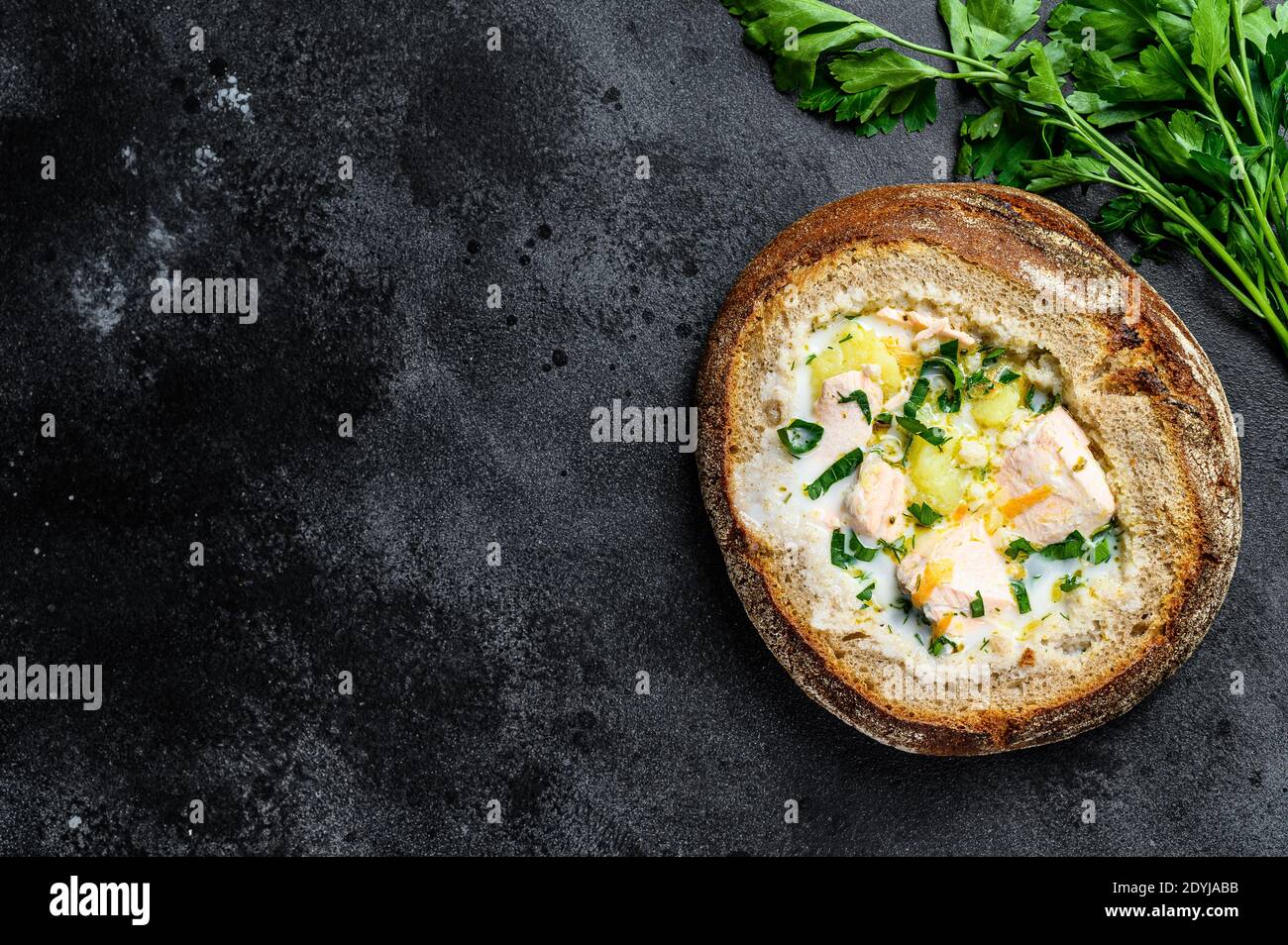 Salmon soup served in bread. Creamy hearty fish soup. healthy and diet ...