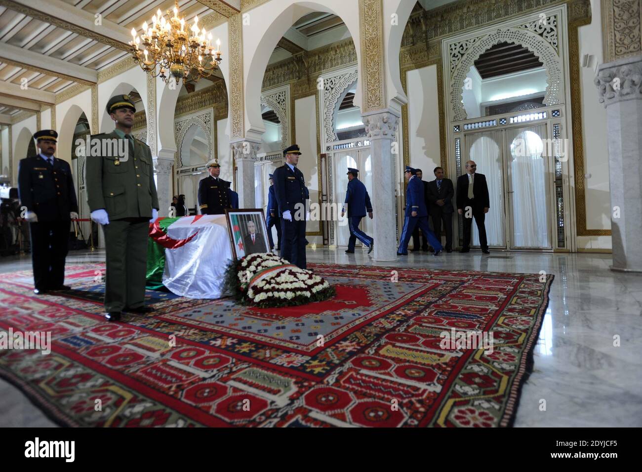 The coffin of Algeria's former head of state Ali Kafi draped in his ...