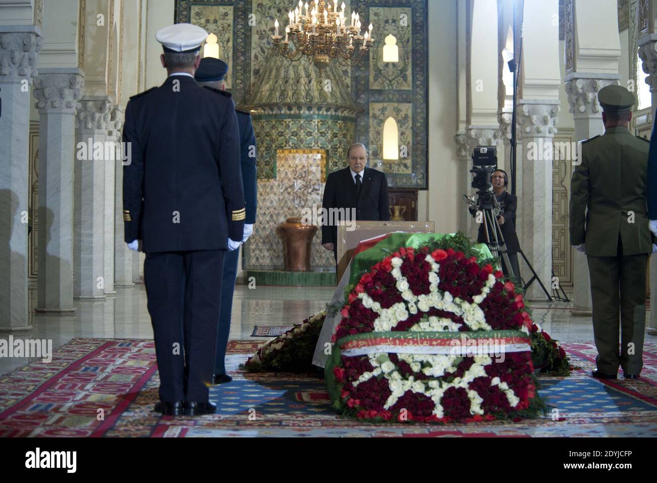 Algerian President Abdelaziz Bouteflika pays his respects in front of ...