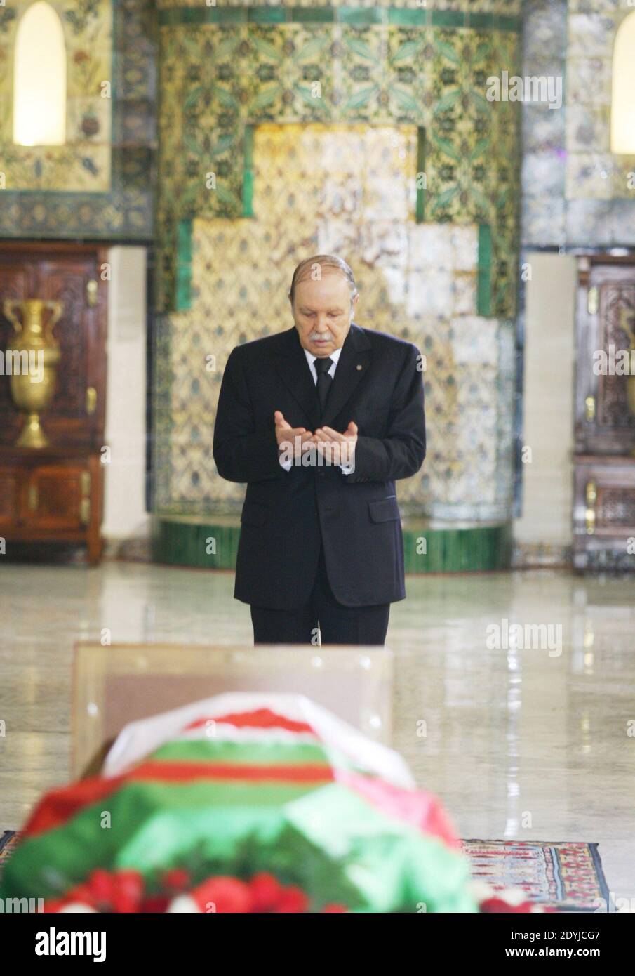 Algerian President Abdelaziz Bouteflika pays his respects in front of ...