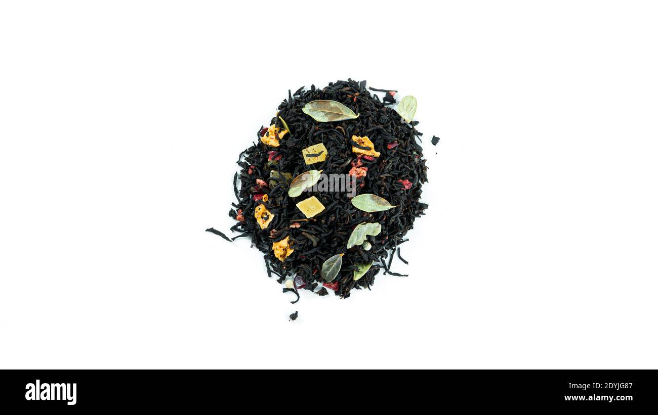 Bunch of black tea leaves with fruits on white background. Top view ...