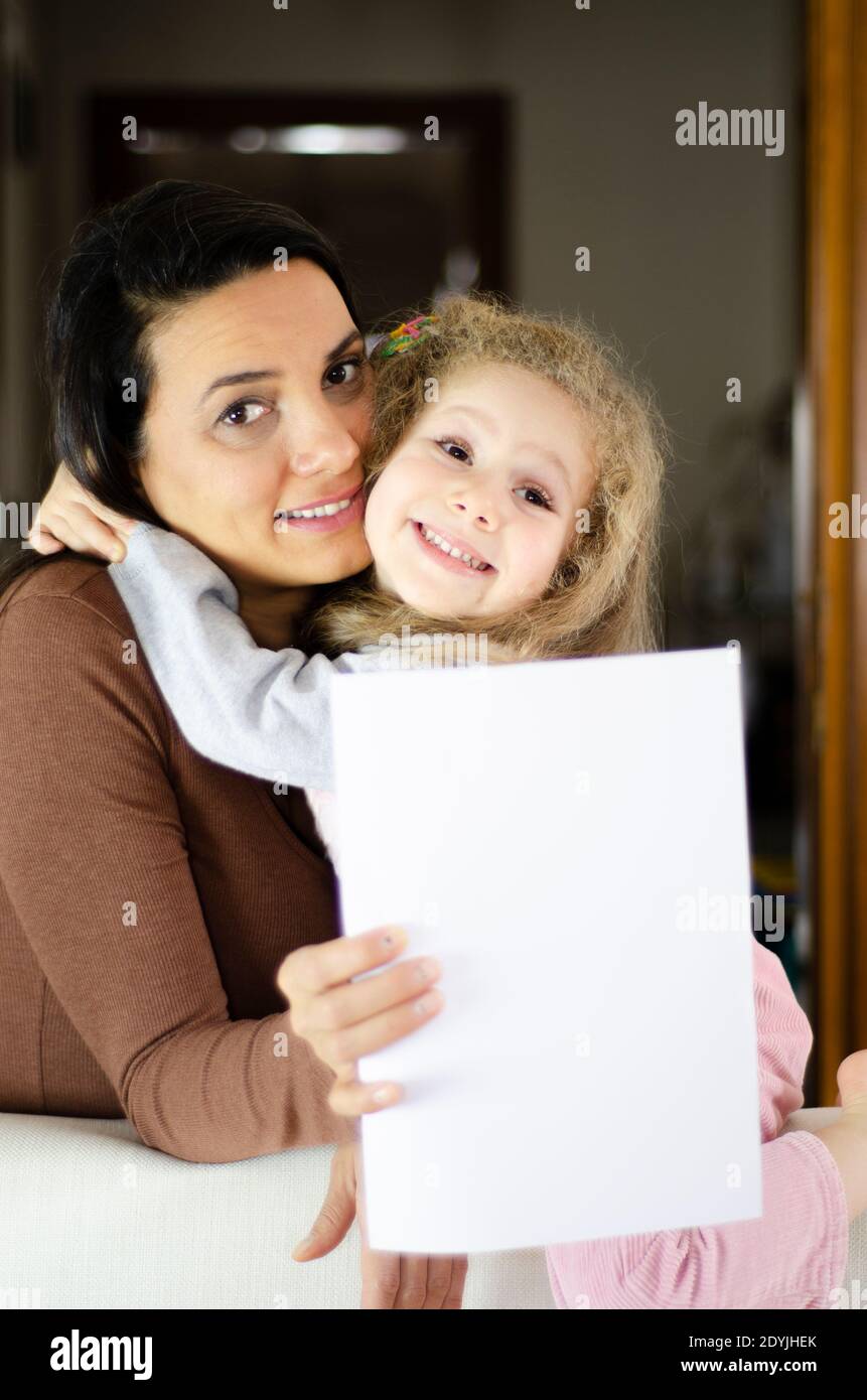 mother and little daughter hugging happily Stock Photo - Alamy