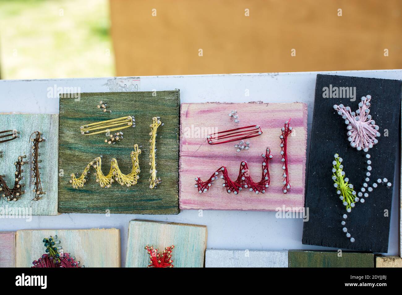 A closeup shot of handcrafted wooden pieces with Islamic symbols Stock ...