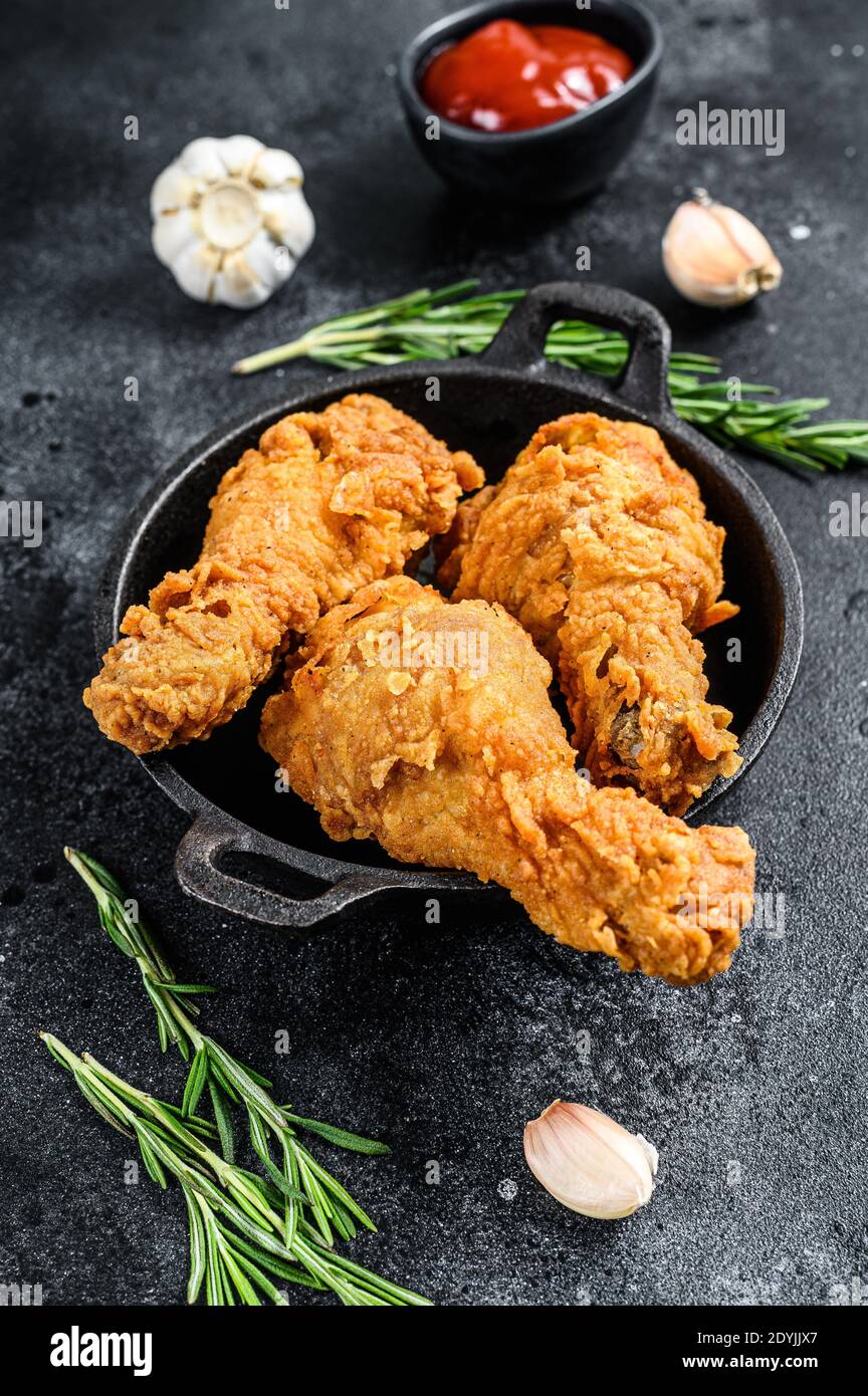 Spicy Deep Fried Breaded Chicken drumsticks. Black background. Top view ... Spicy Deep Fried Breaded Chicken drumsticks. Black background. Top view ...