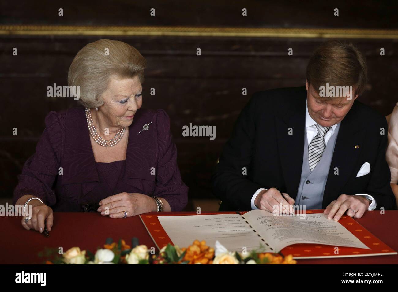 King Willem-Alexander signs the Act of Abdication as his mother ...